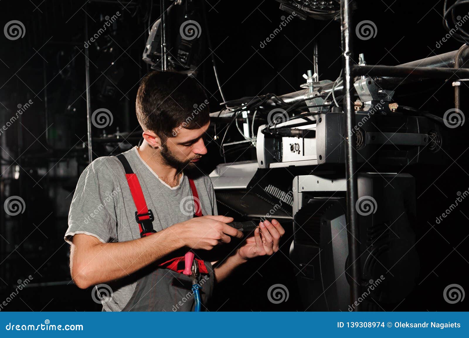 The Lighting Engineer Adjusts the Lights on the Stage. Stock Photo ...
