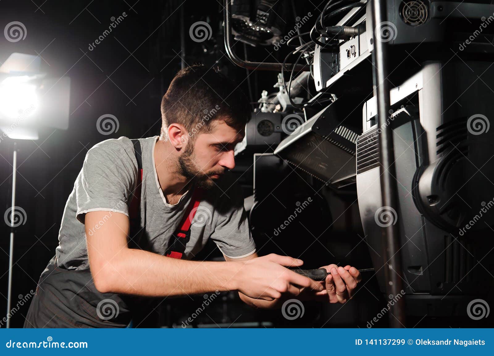 The Lighting Engineer Adjusts the Lights on the Stage. Stock Image ...