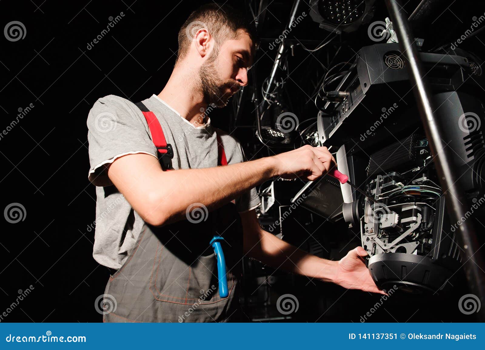 The Lighting Engineer Adjusts the Lights on the Stage. Stock Image ...
