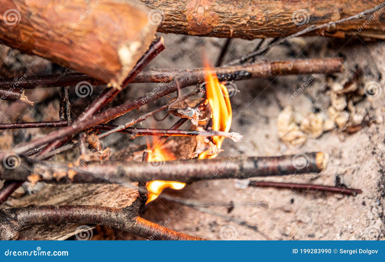 Lighting Fire on Logs. the First Fire on Thin Rods Stock Photo - Image ...