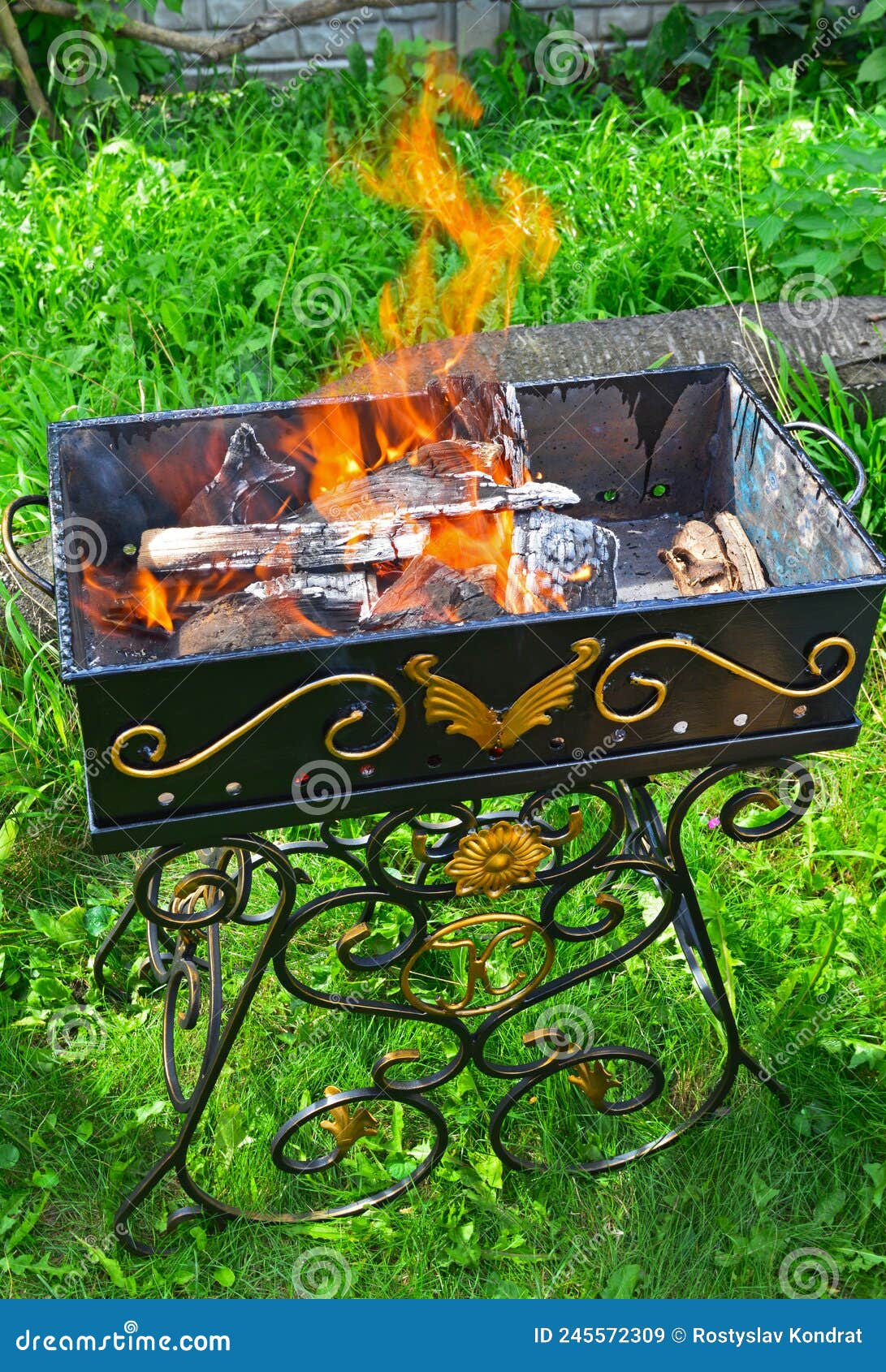 Lighting a Fire in a Metal Grill for Cooking Kebabs and Steaks Stock ...