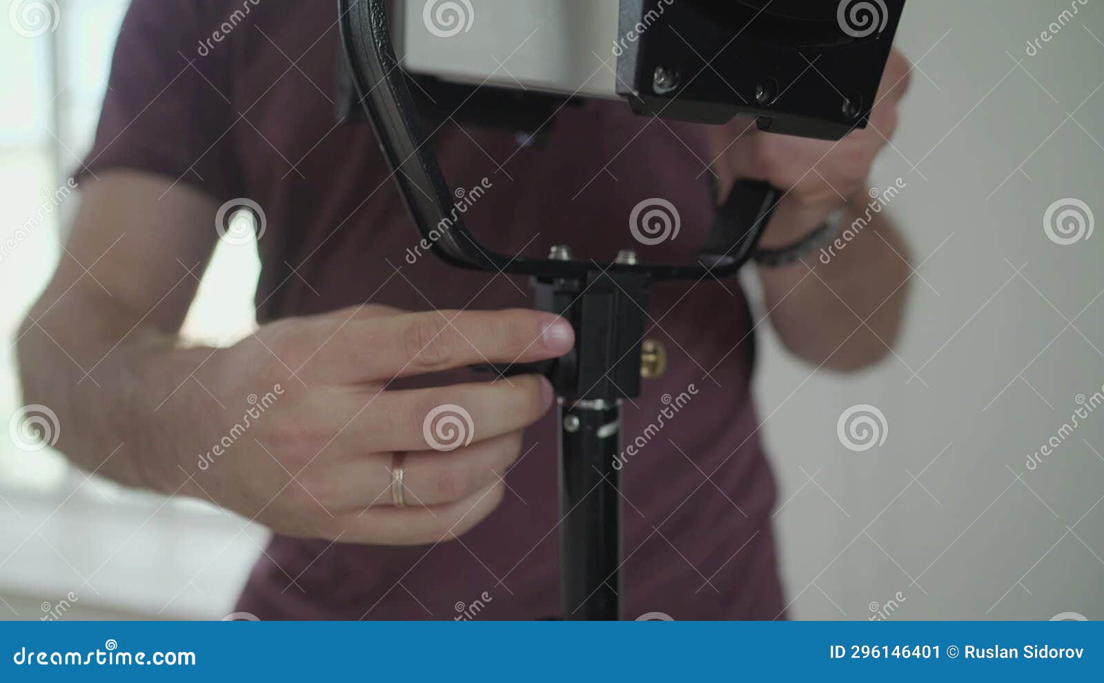Lighting Man Placing a Sheet of Diffuser on a Studio Light in a ...
