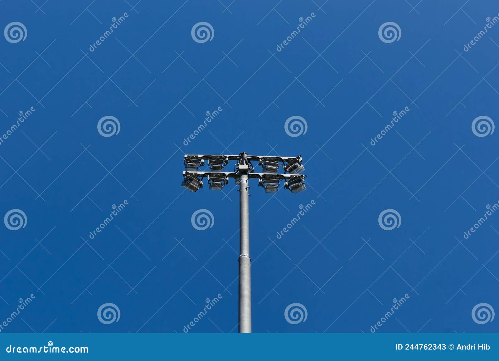 Lighting for the Stadium on a Background of Blue Sky. Pillar with Lamps ...