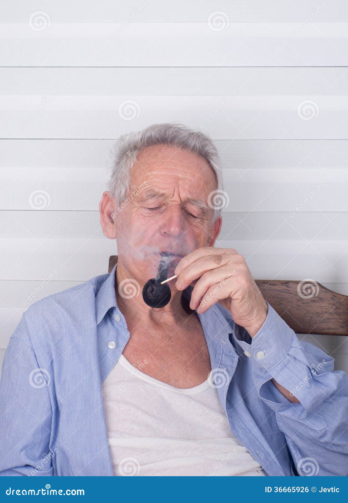 Lighting up pipe stock photo. Image of enjoying, expresion - 36665926