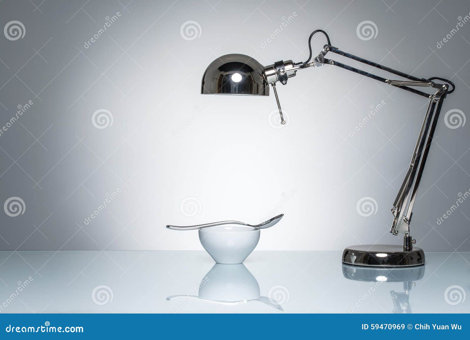 Lighting Up White Ceramic Bowl Silver Spoon with Desk Lamp Stock Image ...