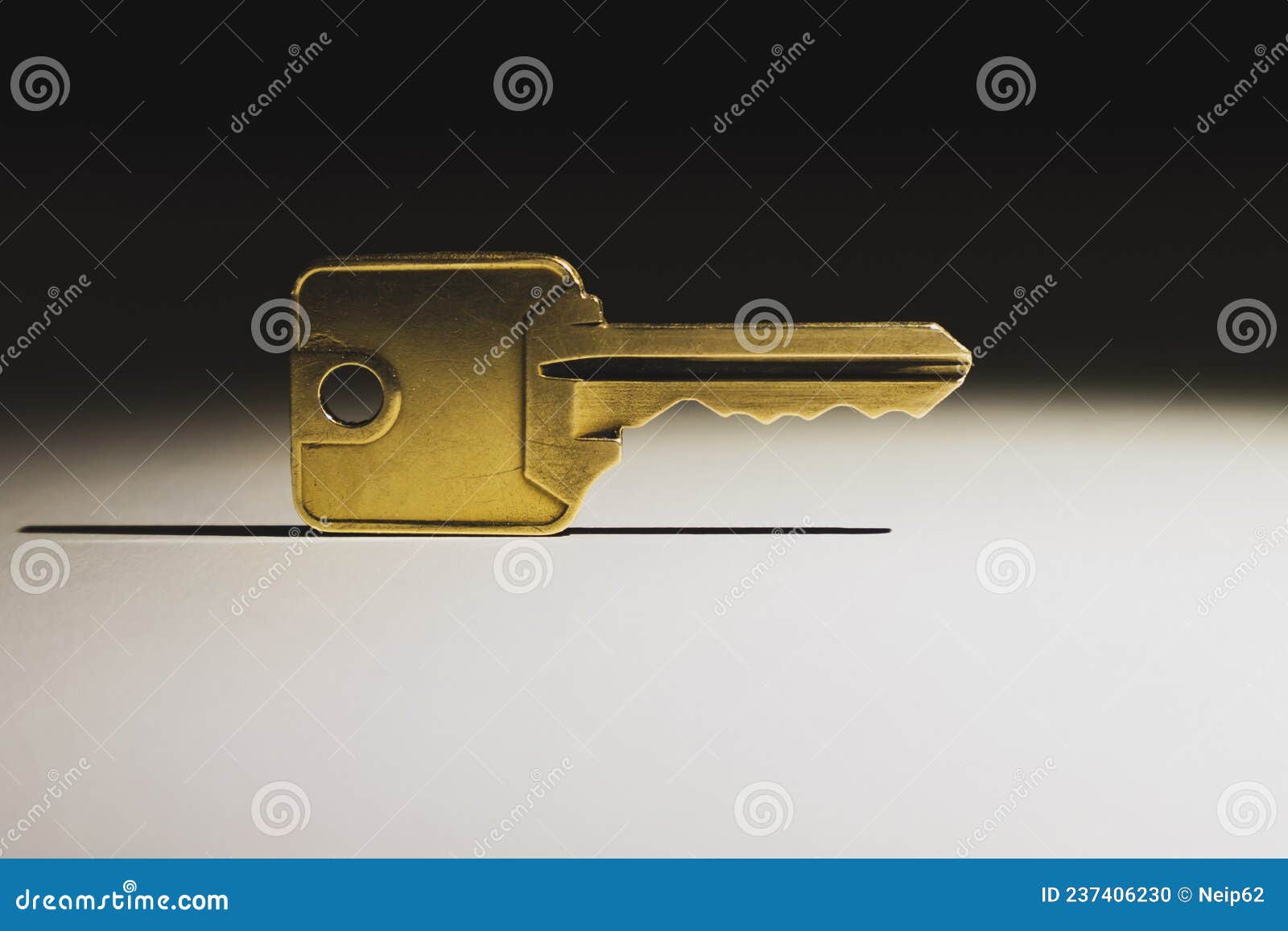 Lightly Illuminated Metal Door Key with a Narrow Shadow Stock Photo ...