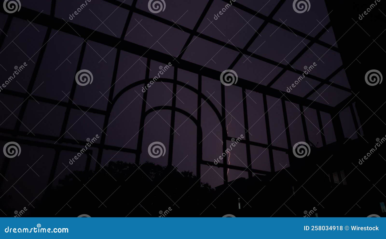 Lightning in a Night Sky Behind the Glass Window Structure Stock Photo ...