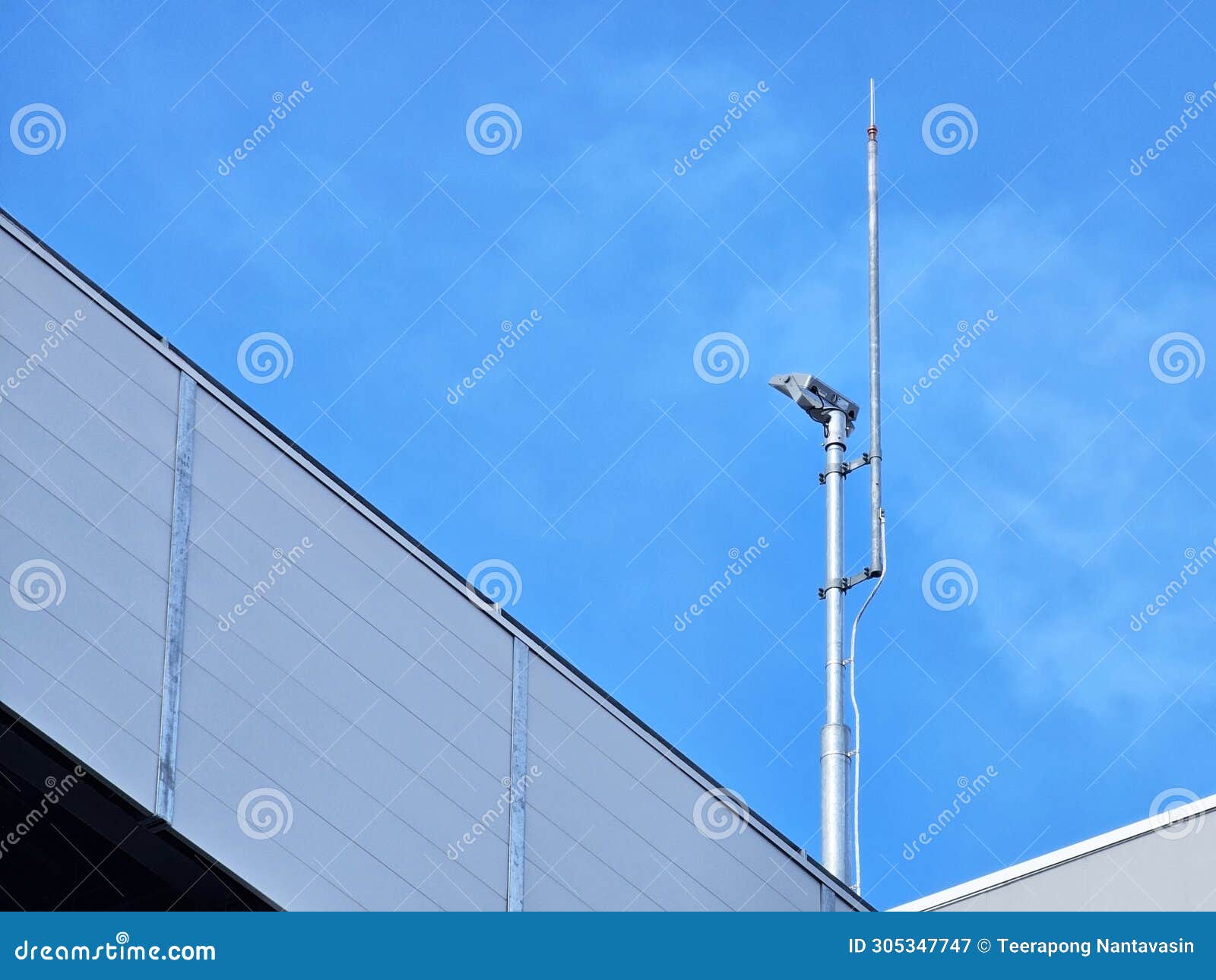 Lightning Rod on the Roof of Building with Blue Sky Background. Stock ...