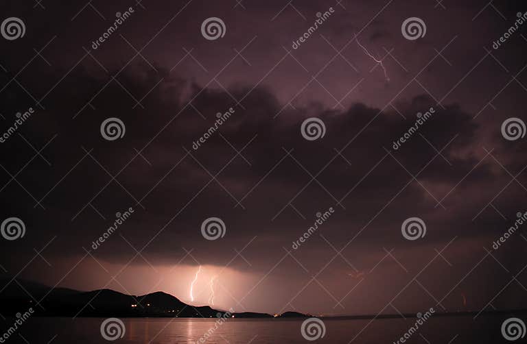 Lightning storm over lake stock image. Image of thunder - 9054465