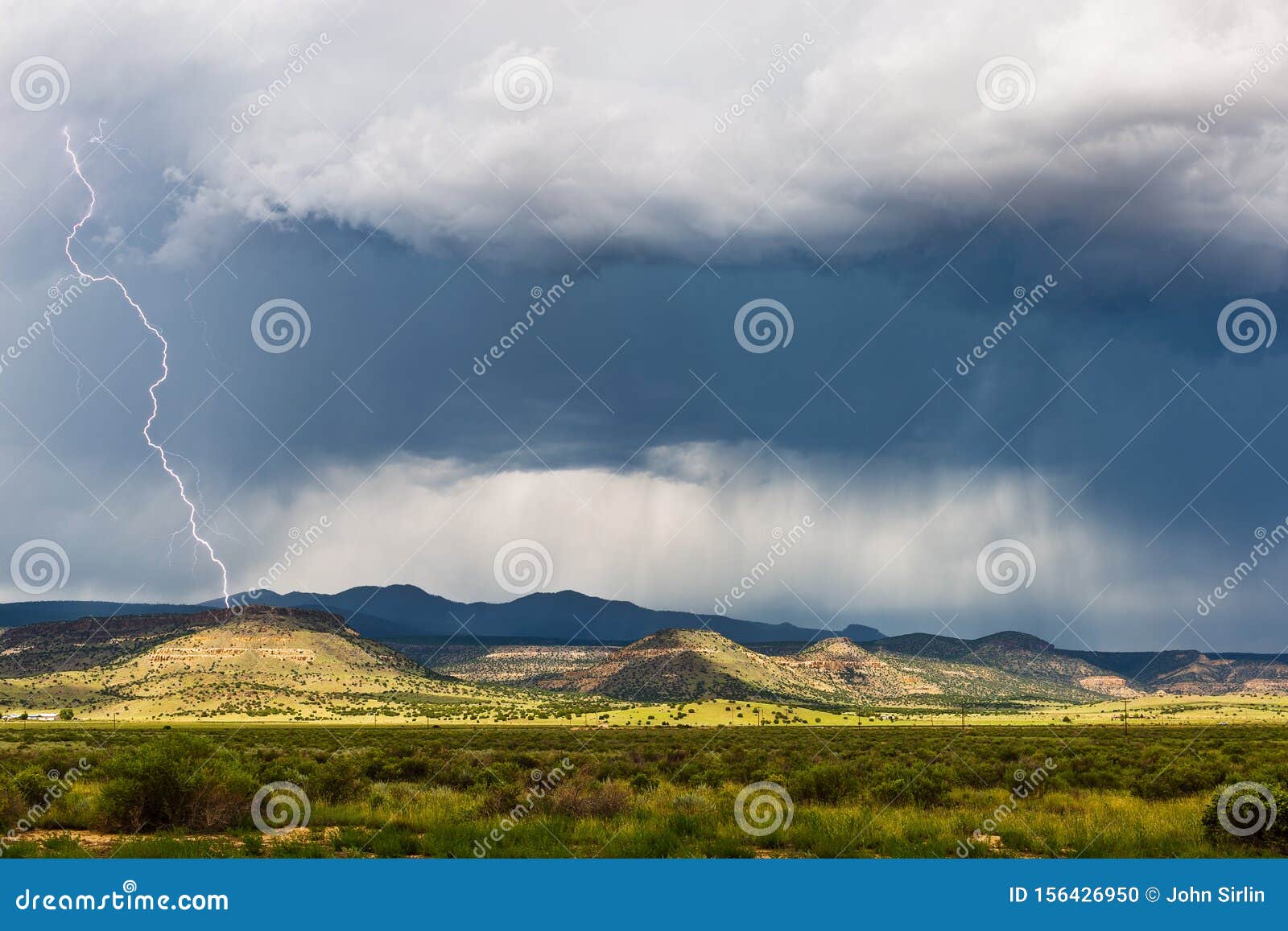 Lightning Strikes a Hill during a Thunderstorm Stock Photo - Image of ...