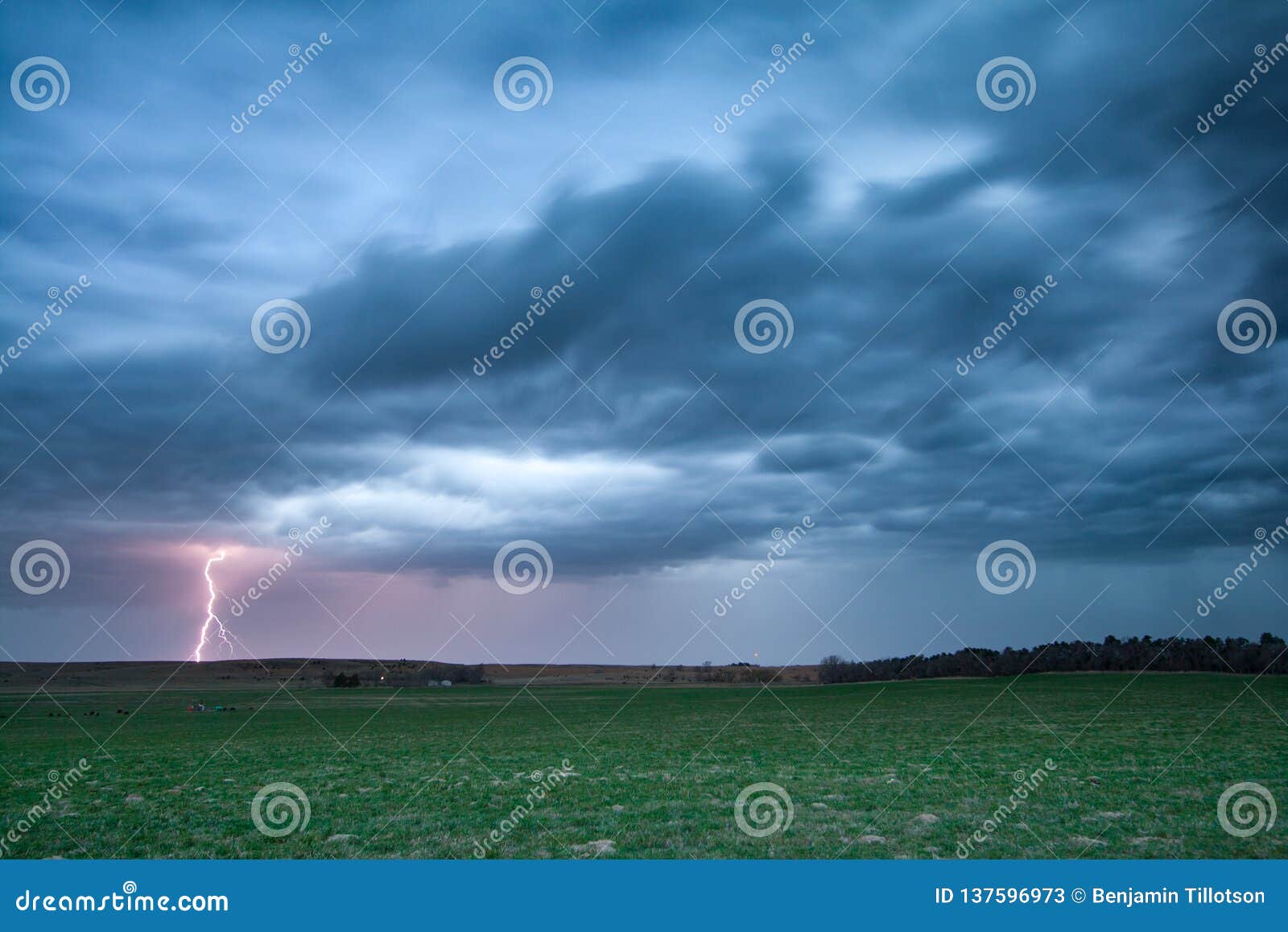 Lightning Striking the Ground Below a Spring Thunderstorm Stock Image ...