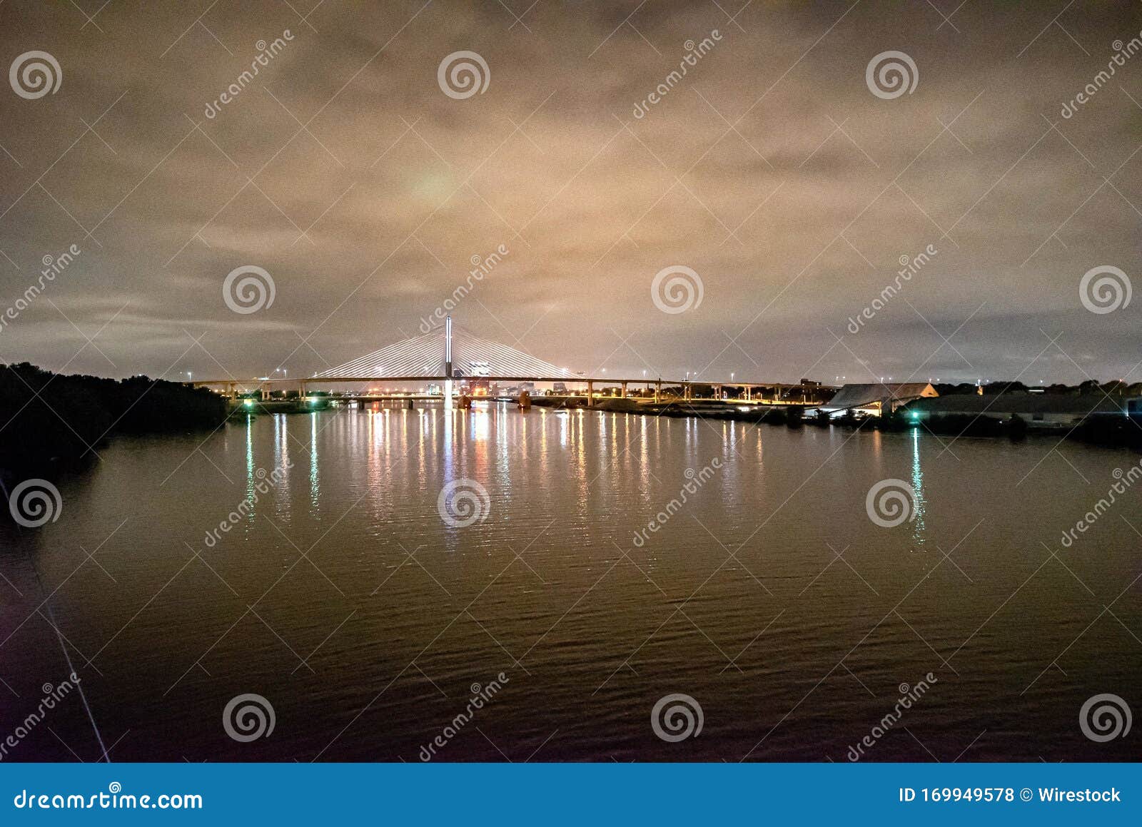 Lights of the Bridge Reflected in the Dark Water at Night Stock Photo ...