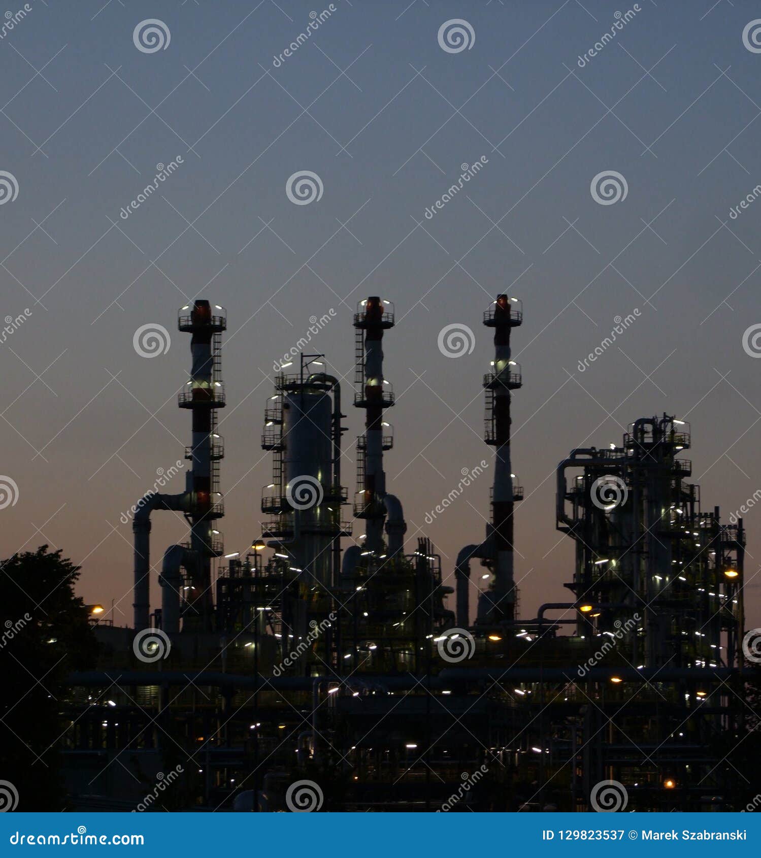 Lights on efinery at dusk stock image. Image of night - 129823537