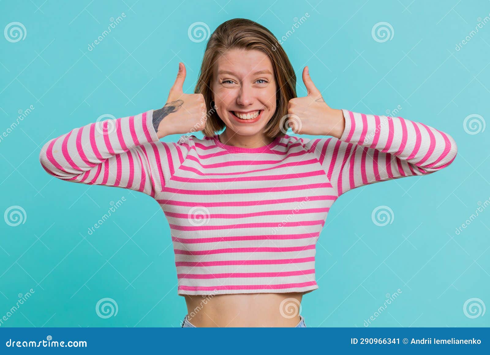 Young Woman Raises Thumbs Up Agrees Or Gives Positive Reply Recommends