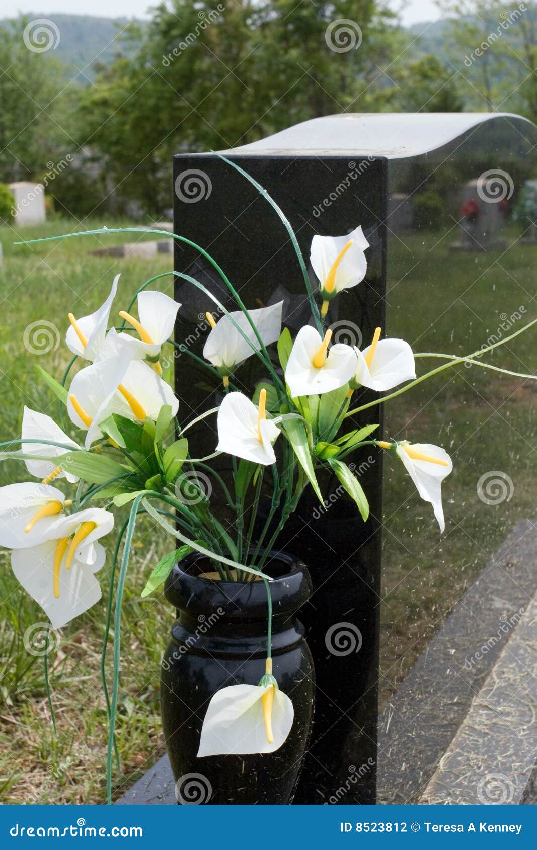 Lilies in Gravestone Vase stock photo. Image of flower - 8523812