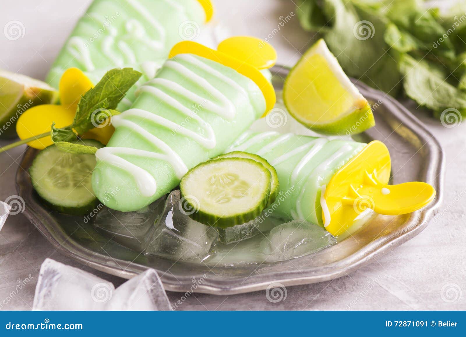 Lime and cucumber ice pops stock image. Image of sticks - 72871091