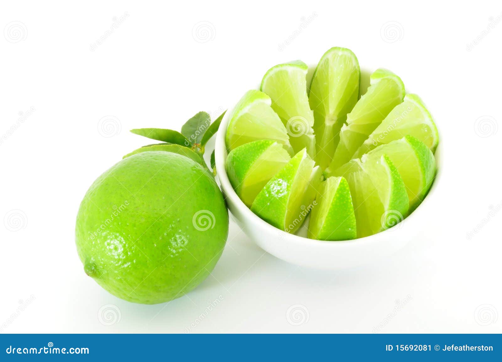 Lime with cut lime in bowl stock image. Image of citrus - 15692081