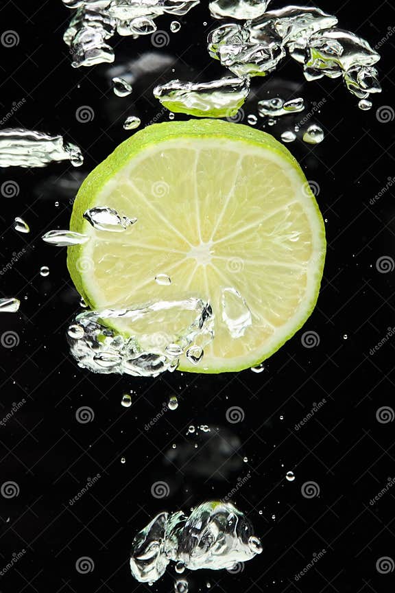 Lime (lemon) Falling in Water on Black Stock Image - Image of splashing ...