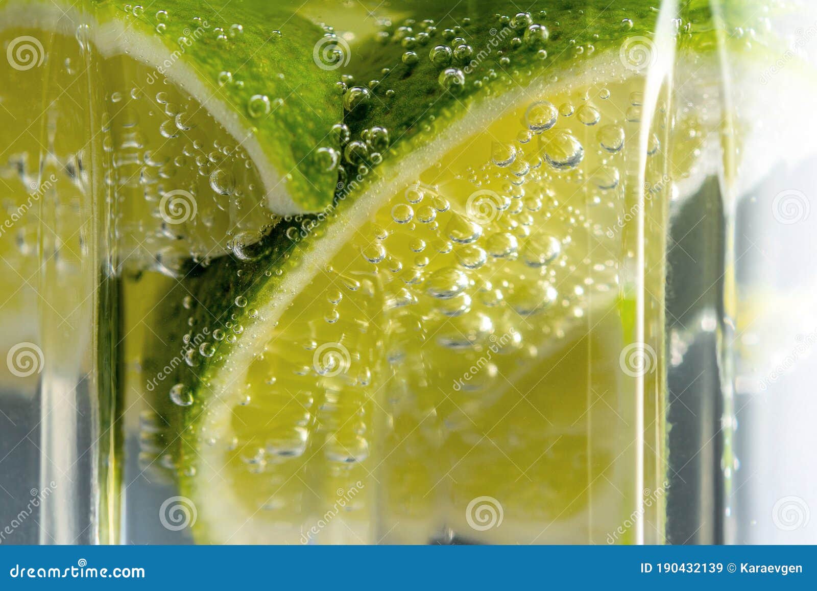 Lime Slice with a Drops in Fizzy Sparkling Water. Summer Drink Concept ...