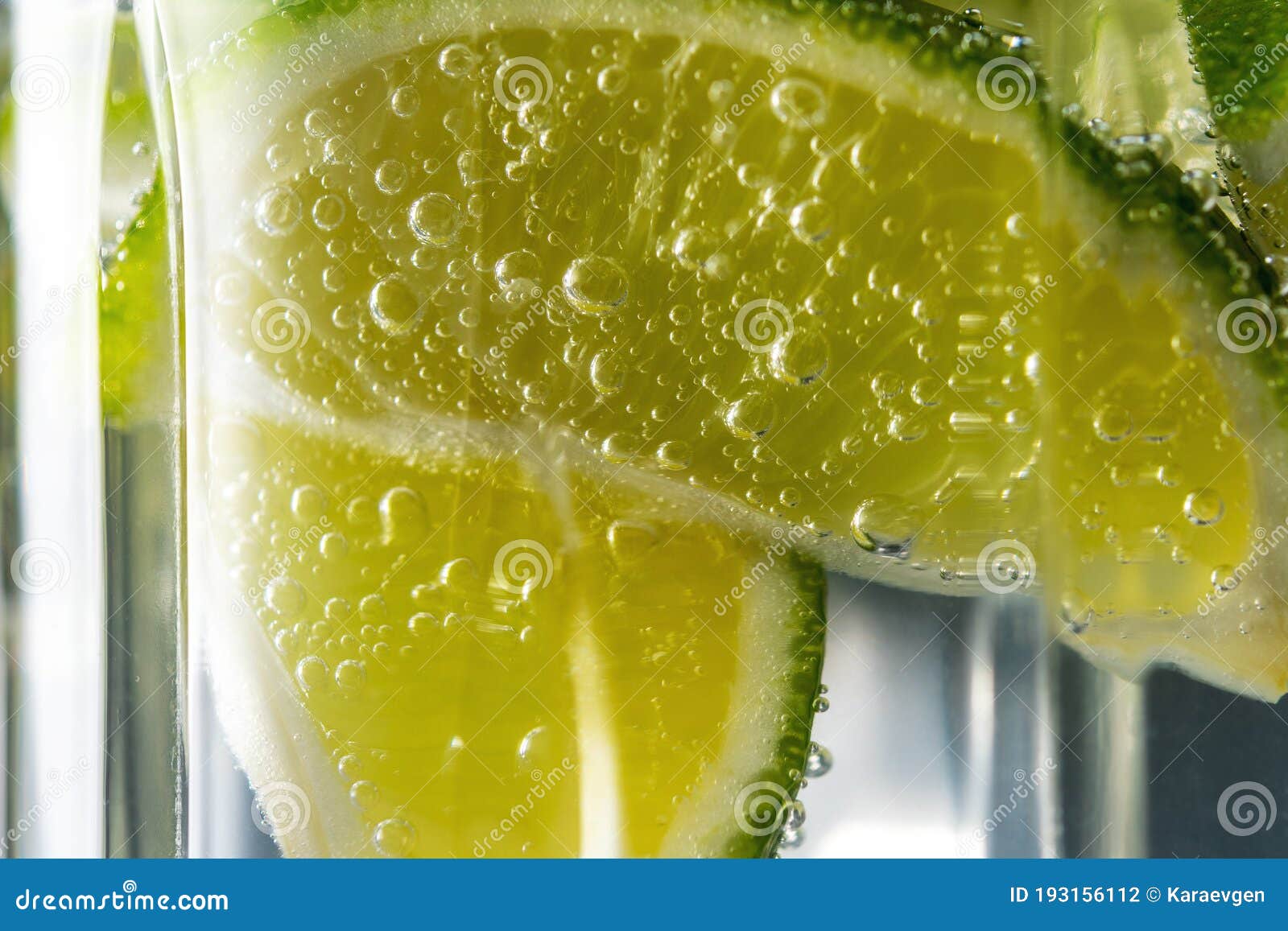 Lime Slice with a Drops in Fizzy Sparkling Water. Summer Drink Concept ...