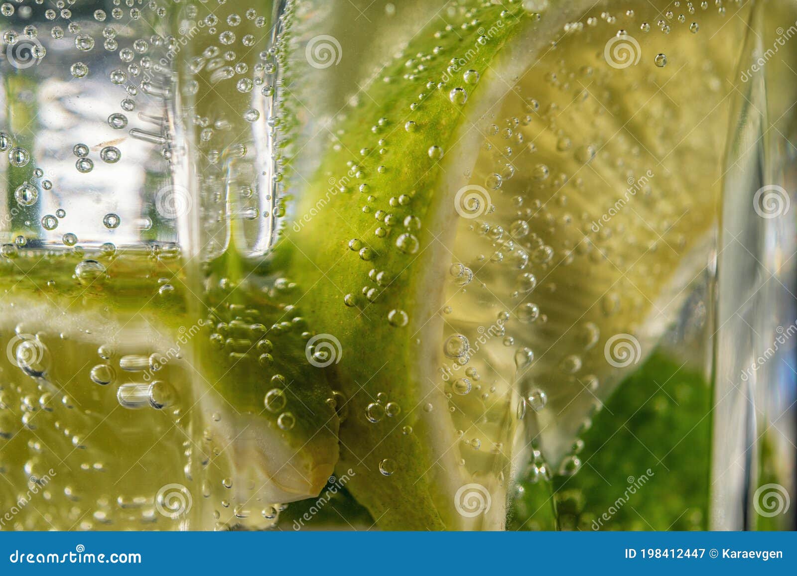 Lime Slice with a Drops in Fizzy Sparkling Water. Summer Drink Concept ...