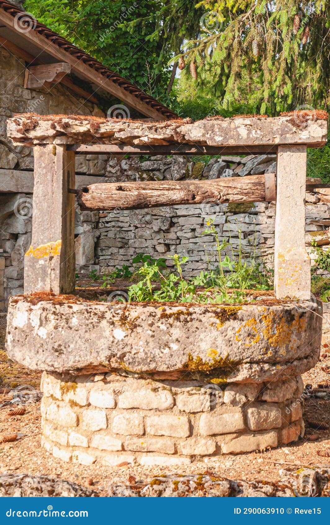 Limestone Block Water Well with Wood Rope Spool and Frame Stock Photo ...