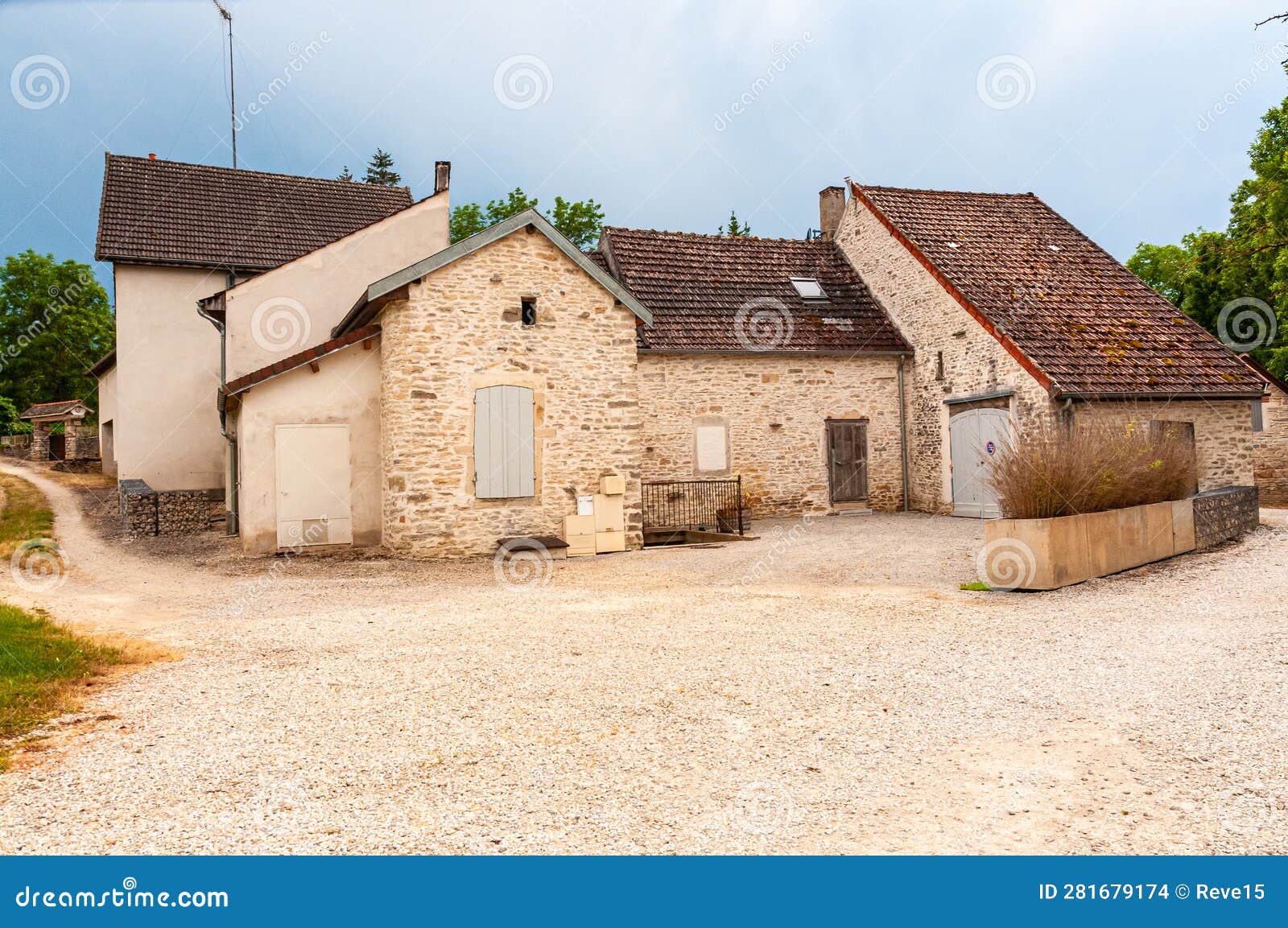 Limestone Buildings with Red Tiled Roofs, and Gravel Driveway Stock ...