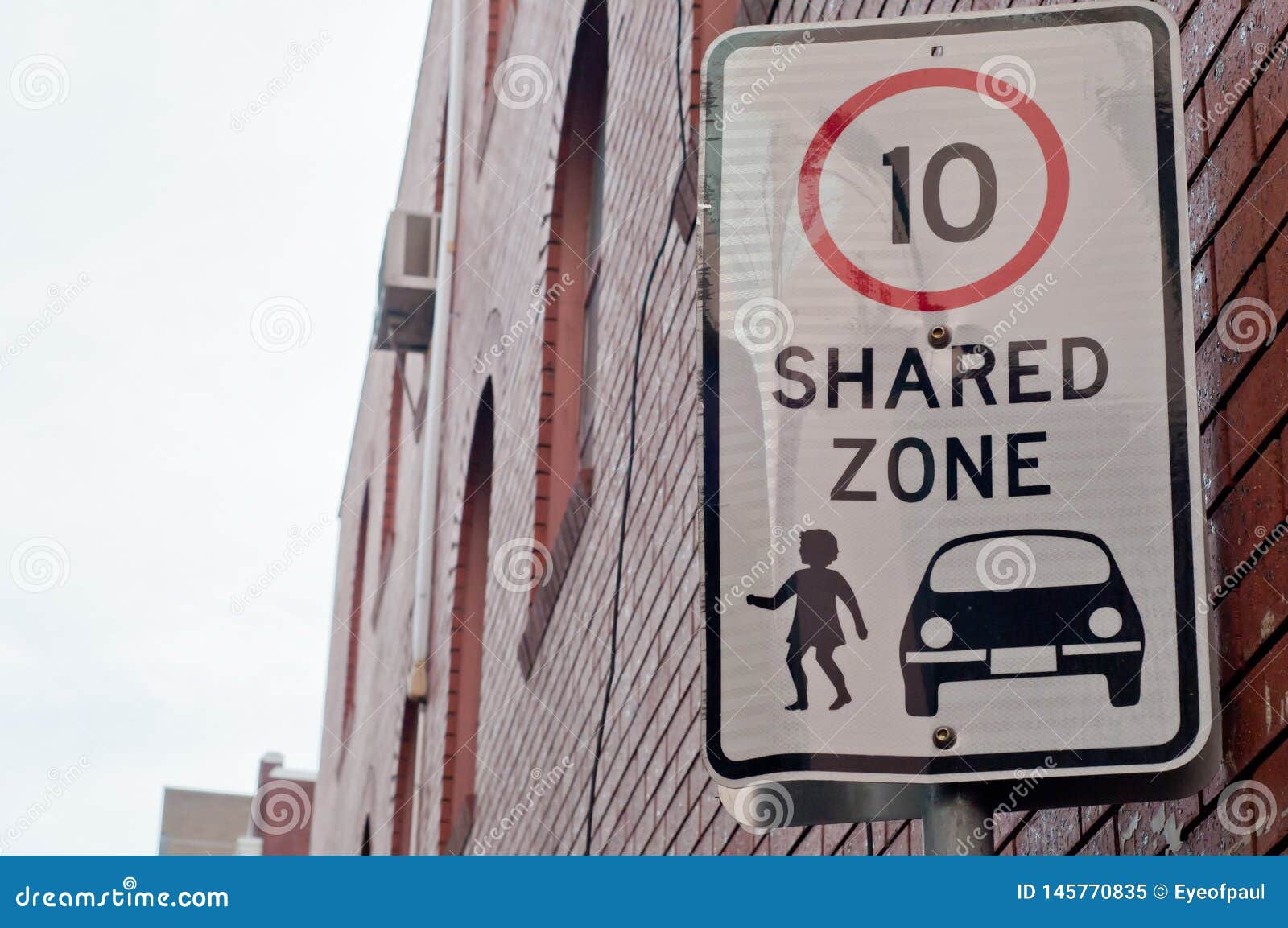 Limit of 10kmph Shared Zone Traffic Sign on Metal Pole Stock Image ...