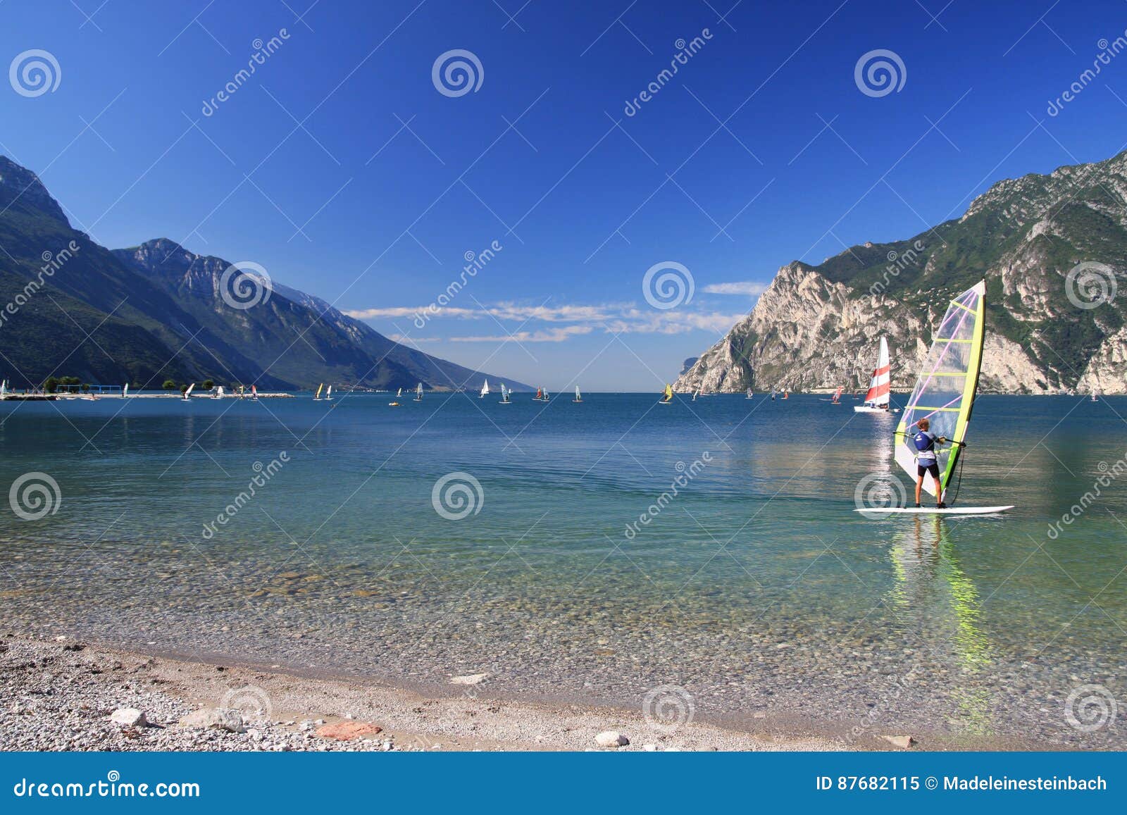 Limpid Waters of Lake Garda in Italy, Surrounded by the Alps Editorial ...