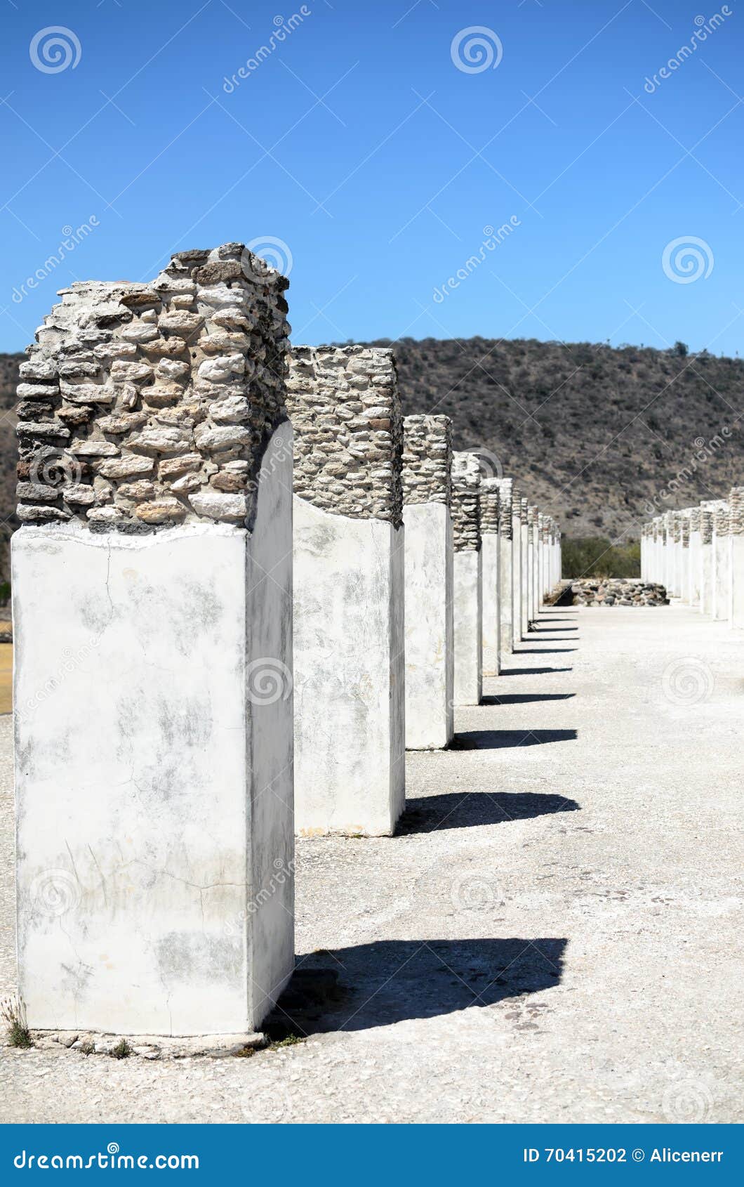 A Line of Ancient Pillars and Shadows from Them Stock Photo - Image of ...
