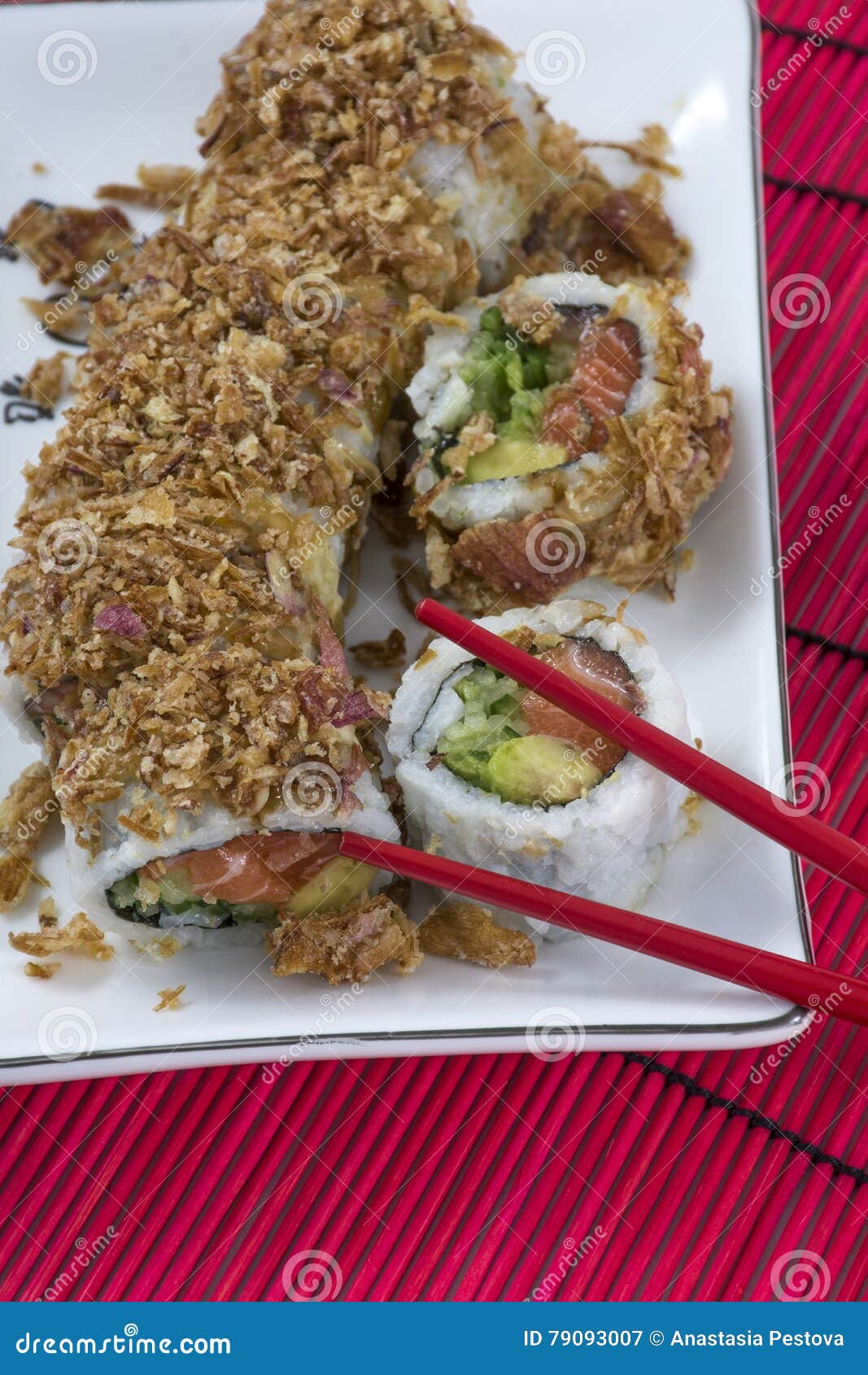 Line of Asian Rolls on the White Plate with Red Chopsticks Stock Image ...