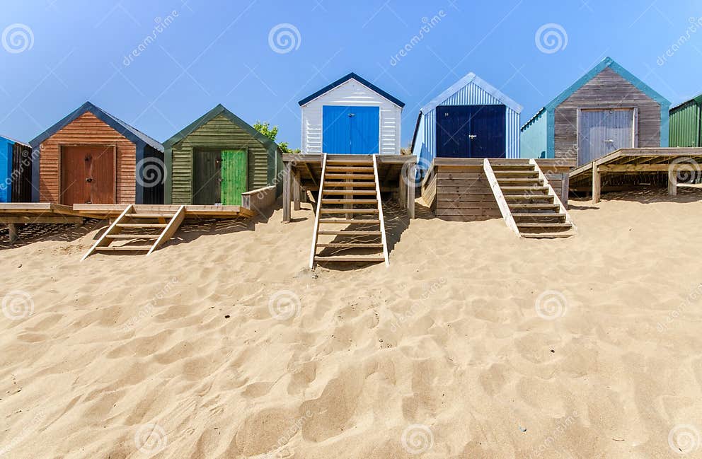 Line of Beach Huts on a Sandy Beach Editorial Stock Image - Image of ...