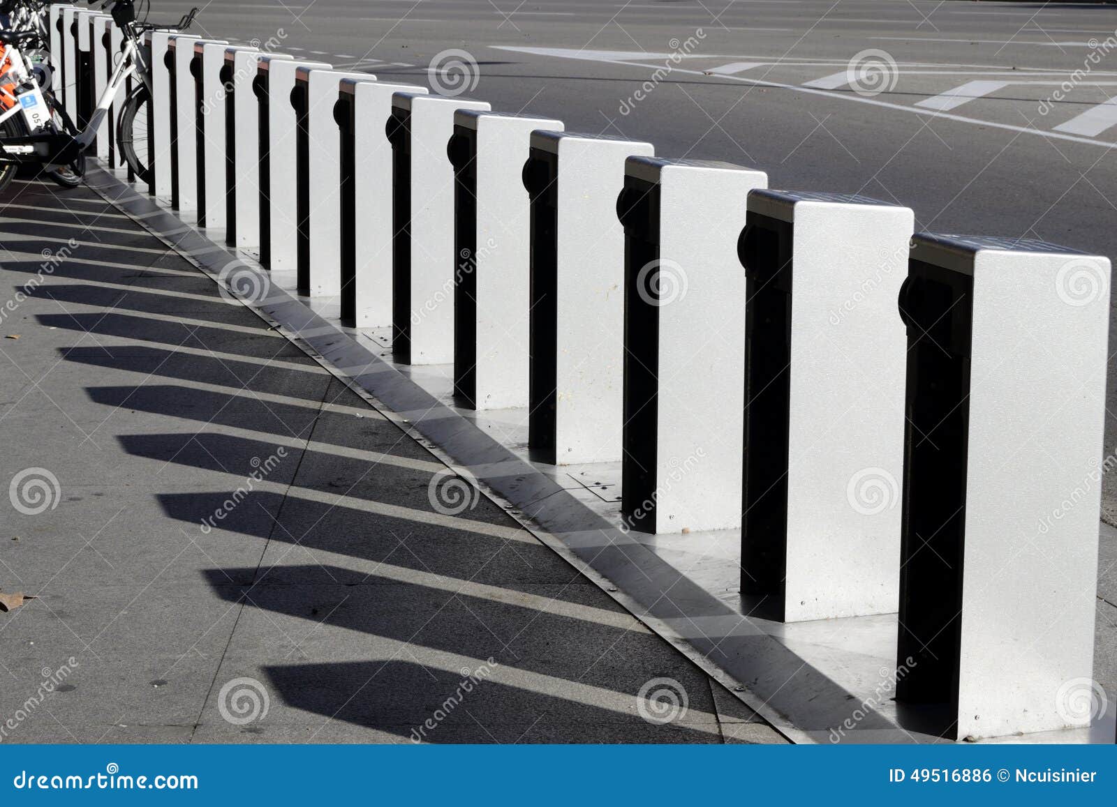 Line of Bicycle Parking Slots Stock Photo - Image of sidewalk, shape ...