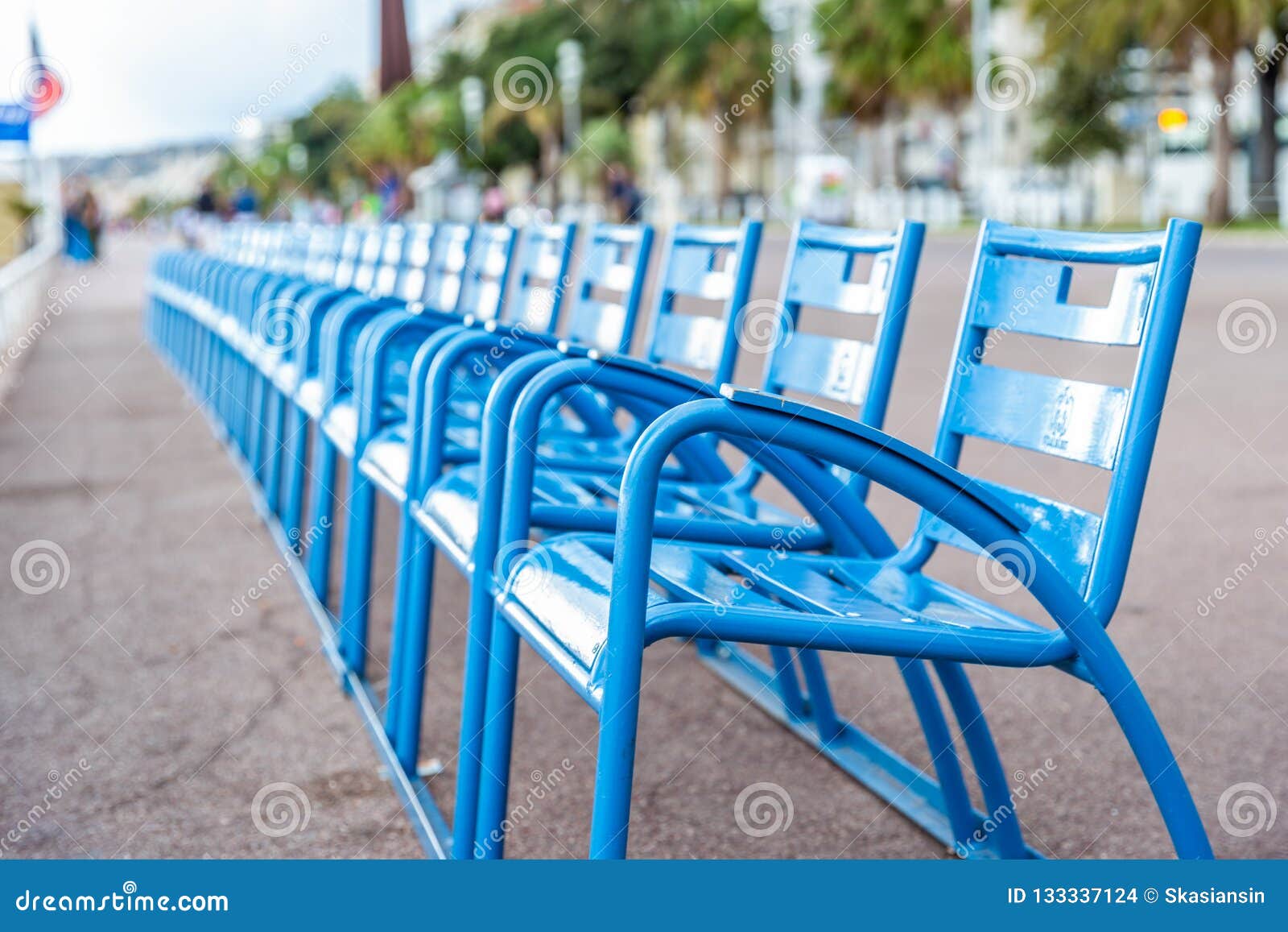 Line of Blue Chairs on Street Stock Photo - Image of line, furniture ...