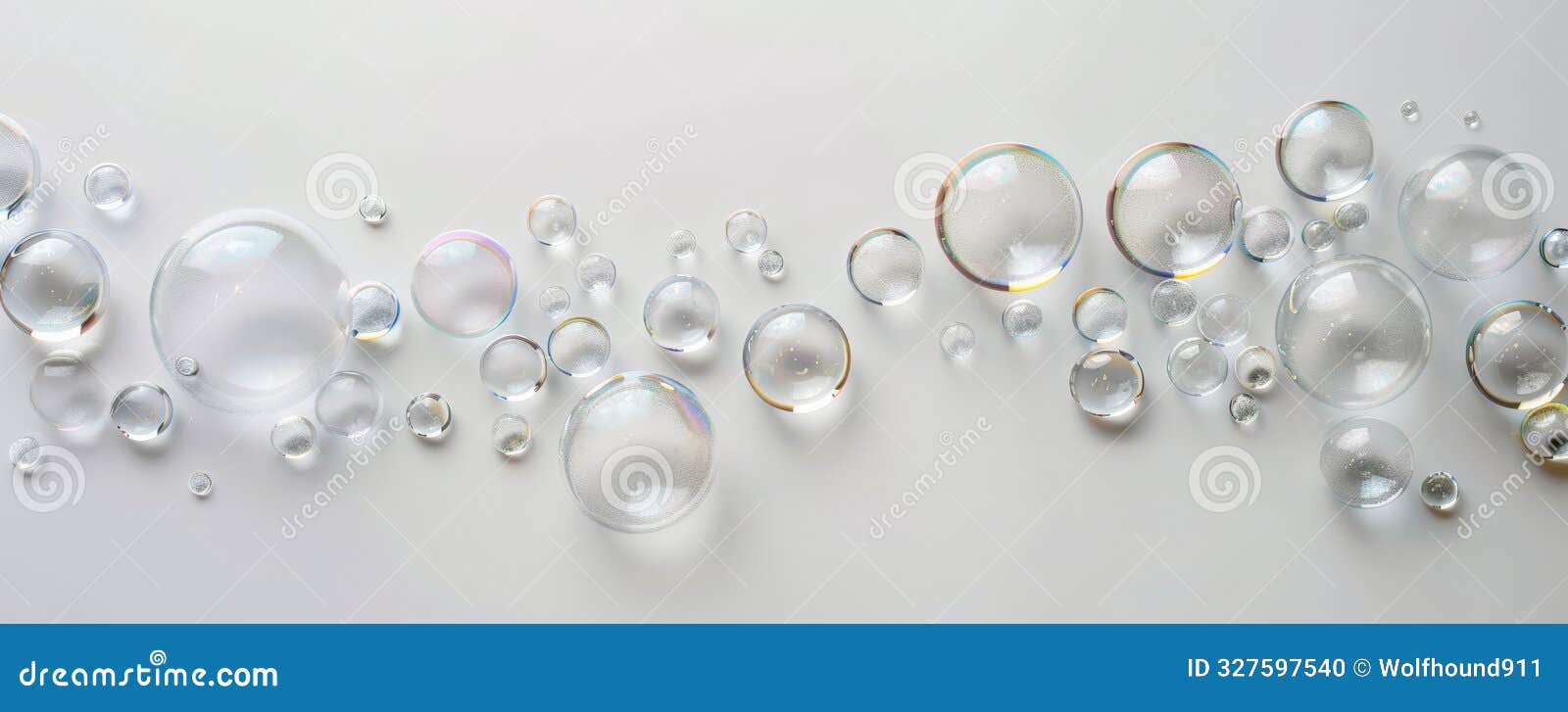 A Line of Bubbles Decreasing in Size from Left To Right on a White ...