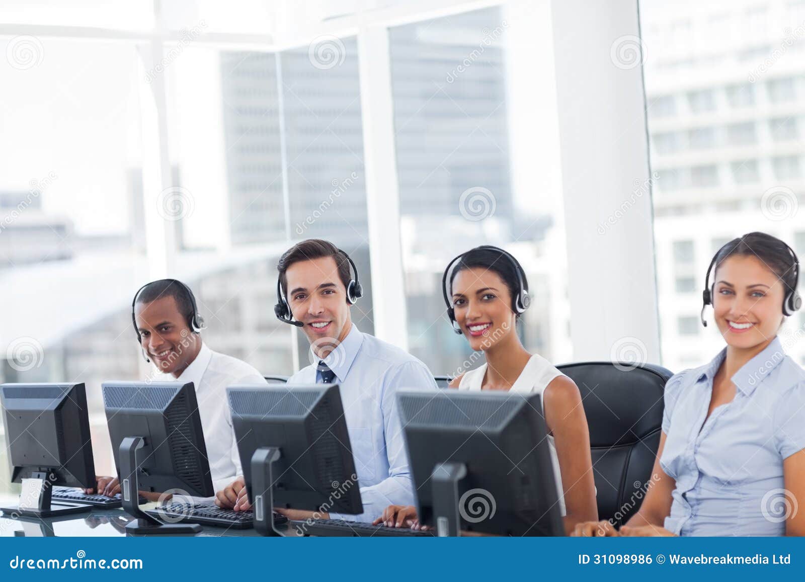 Line of Call Centre Employees Smiling Stock Photo - Image of speaking ...