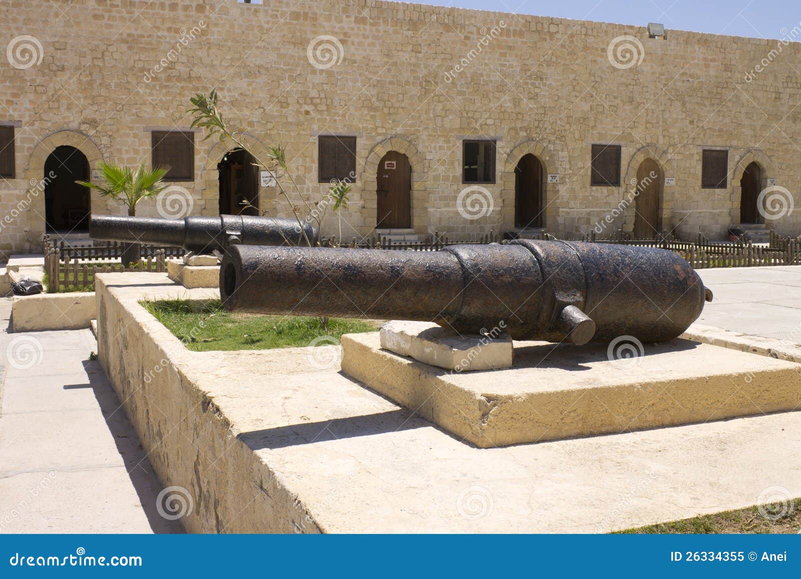 Line of cannons stock image. Image of grass, guns, building - 26334355