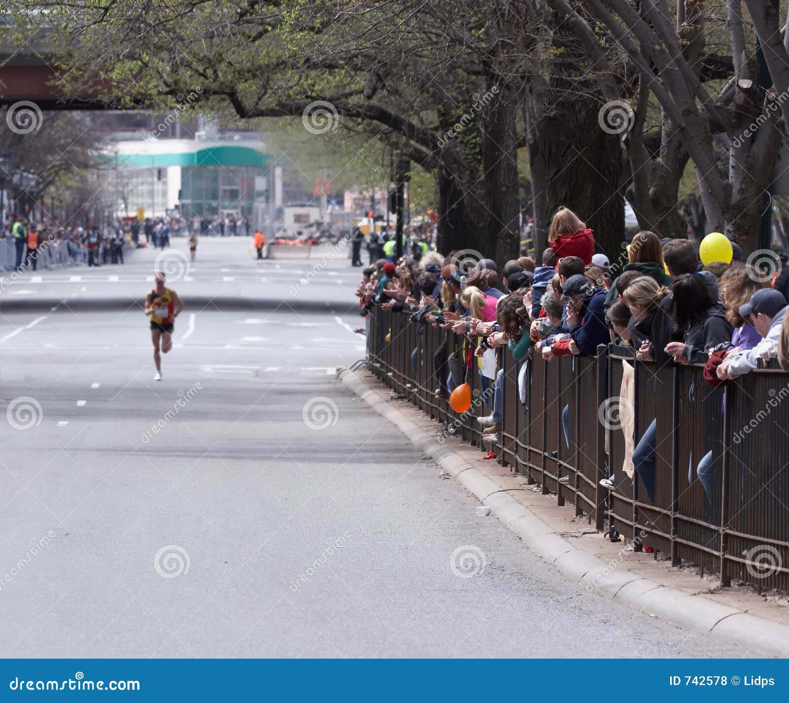 Line of Cheering Fans editorial stock photo. Image of runner - 742578