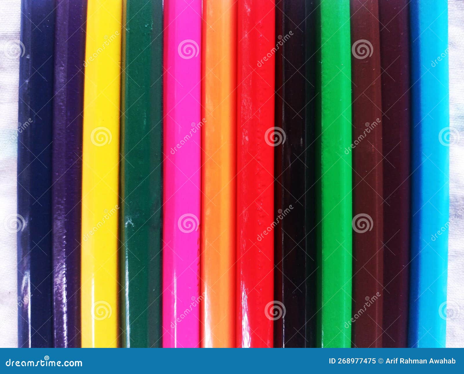 A Line of Coloring Pencils on a White Fabric Stock Image - Image of ...