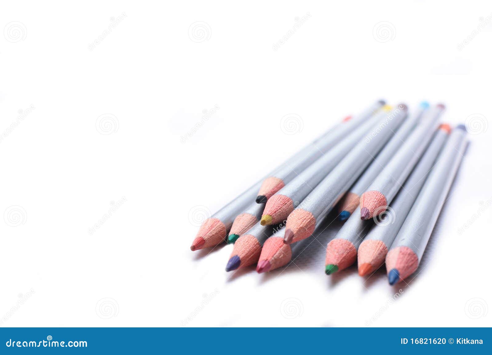 Line of coloured pencils stock photo. Image of black - 16821620