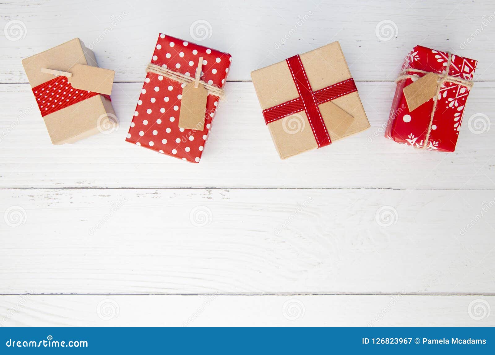 Line of Elegantly Wrapped Gifts Stock Image - Image of holiday, twine ...