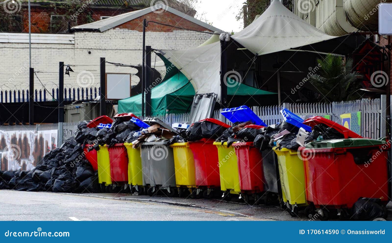 A Line of Red Yellow Full Rubbish Bins Stock Photo - Image of full ...