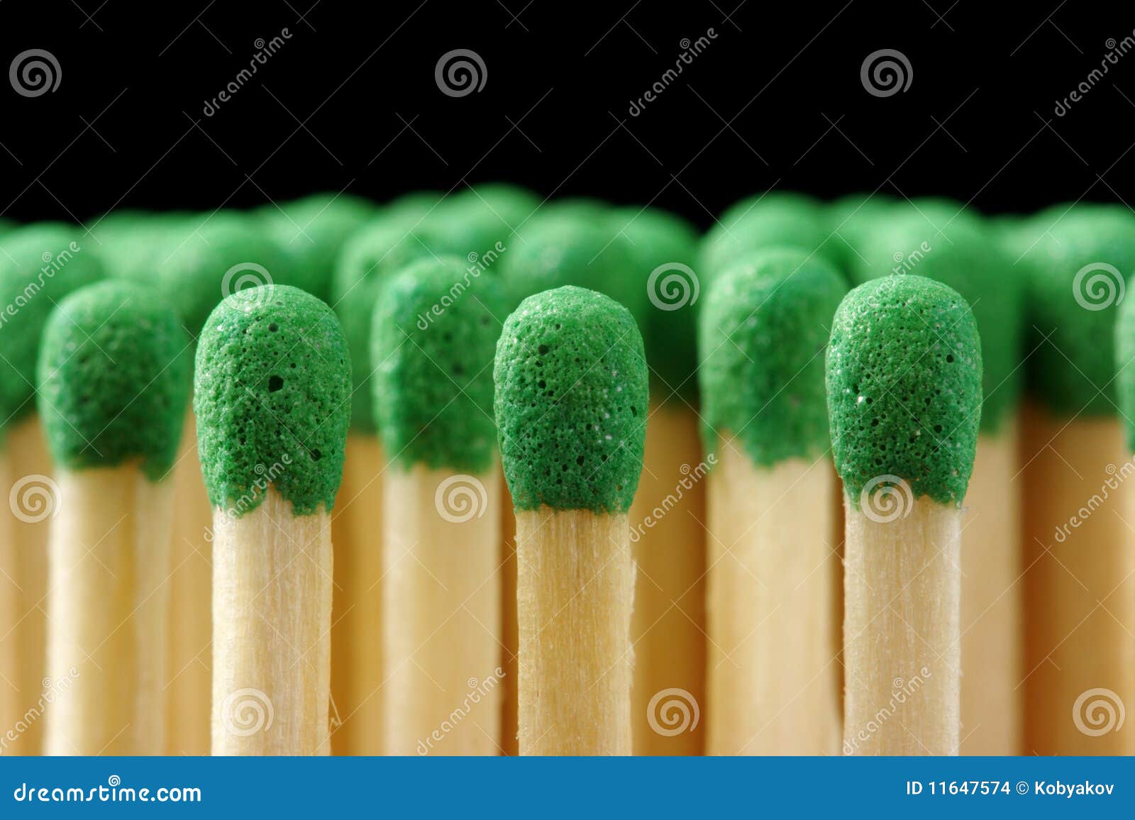 Line of Green Matchsticks on Black Background Stock Photo - Image of ...