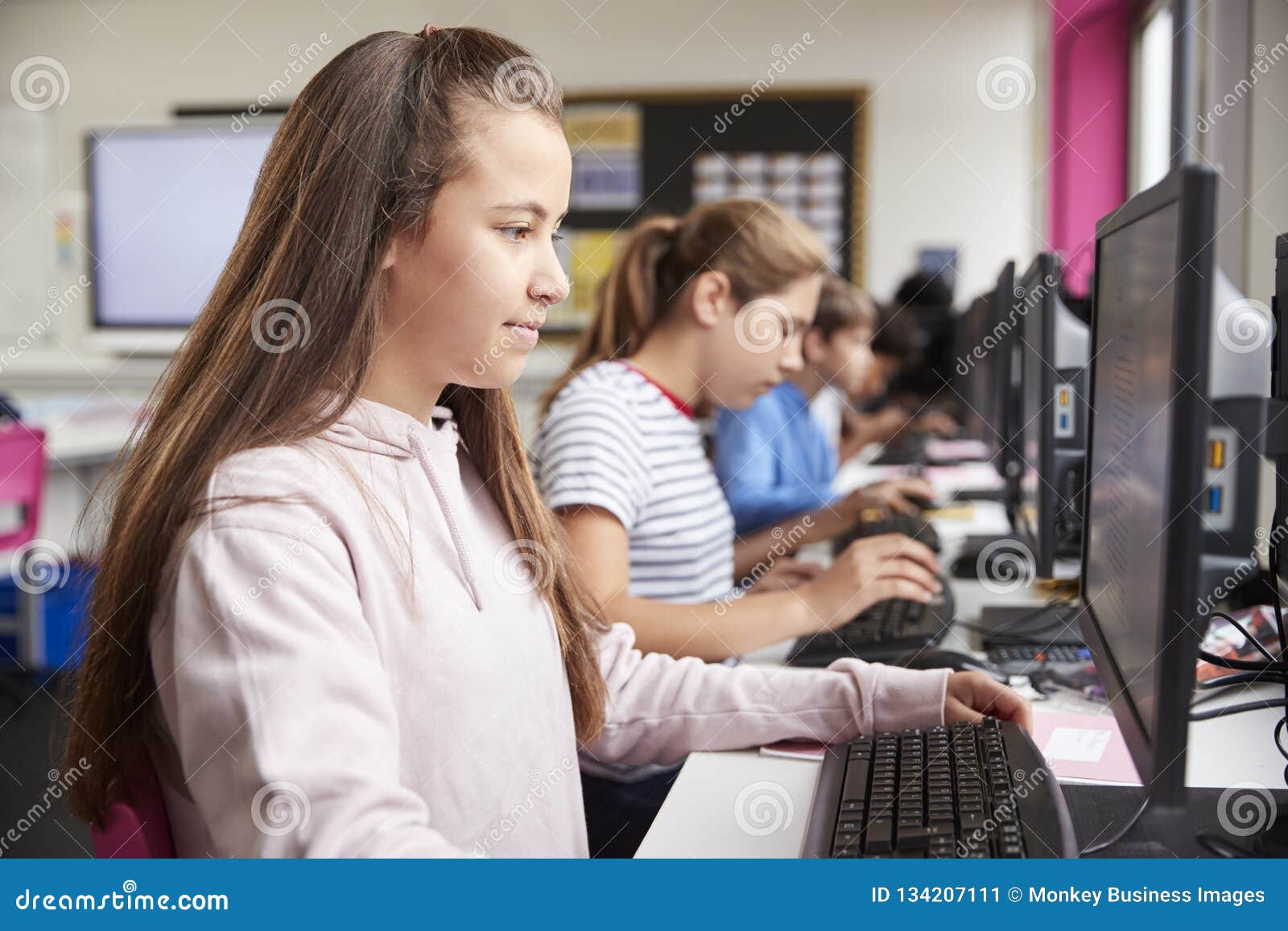 Line of High School Students Working at Screens in Computer Class Stock ... Line of High School Students Working at Screens in Computer Class Stock ...