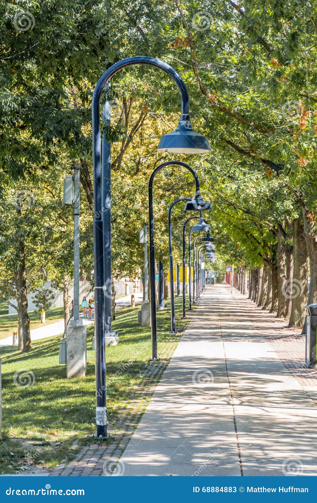 Line of light posts stock image. Image of vivid, city - 68884883