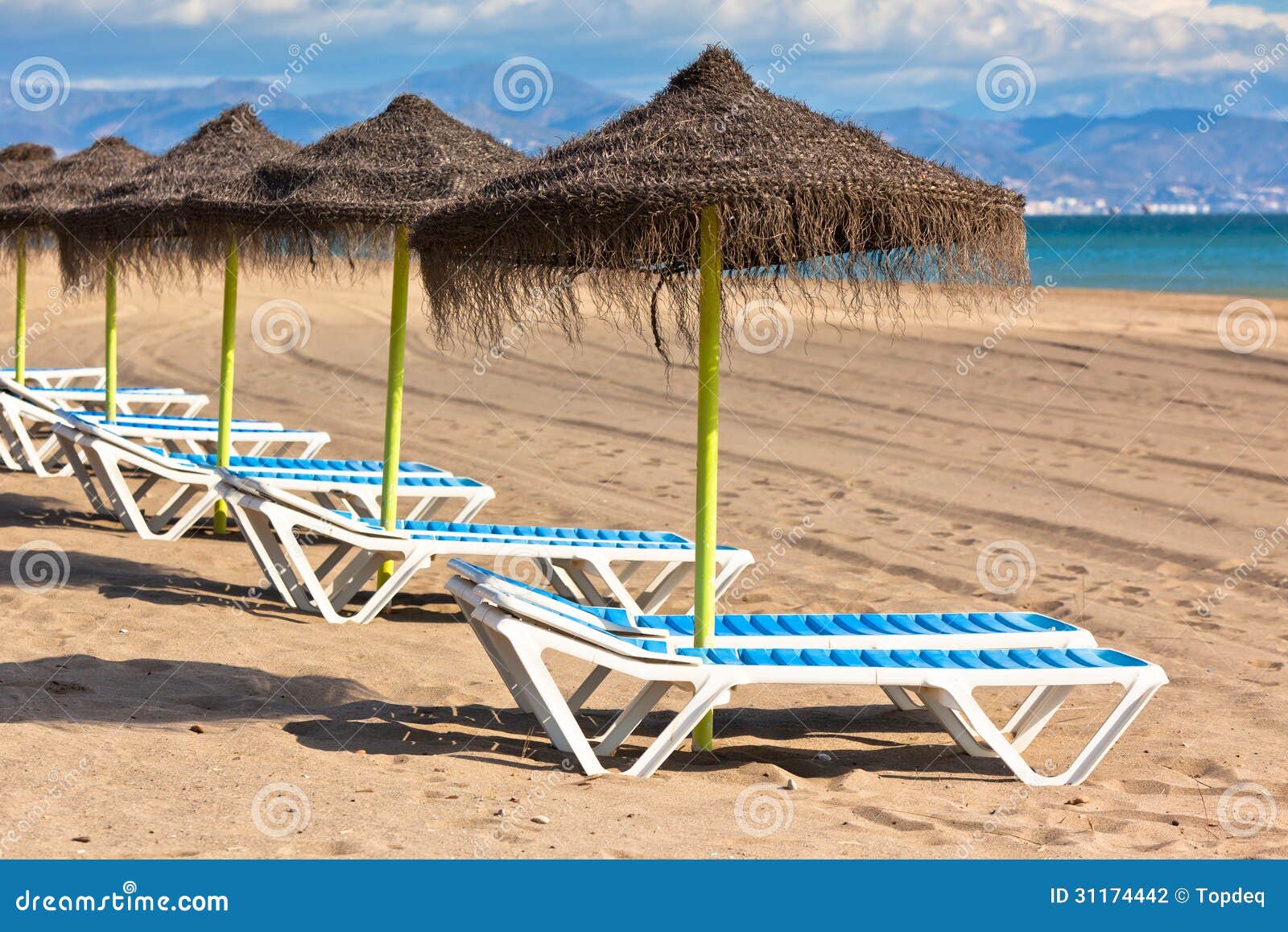 Line of Parasols at Spanish Sand Beach Stock Photo - Image of relax ...