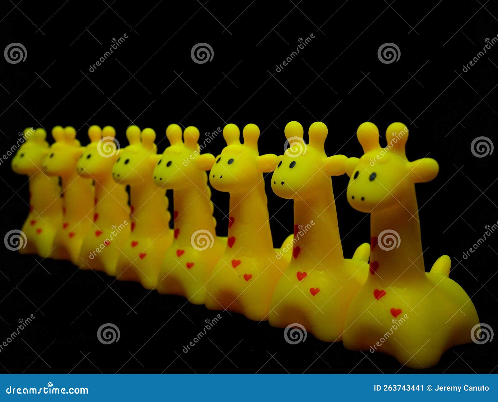 A line of rubber giraffes stock image. Image of yellow - 263743441
