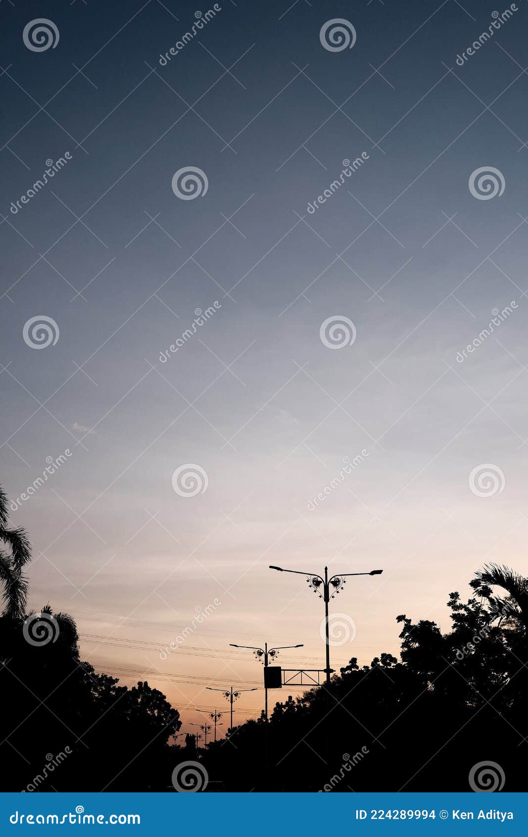 A Line Of Silhouette Of Road Lamps Under The Sunset Royalty-Free Stock ...