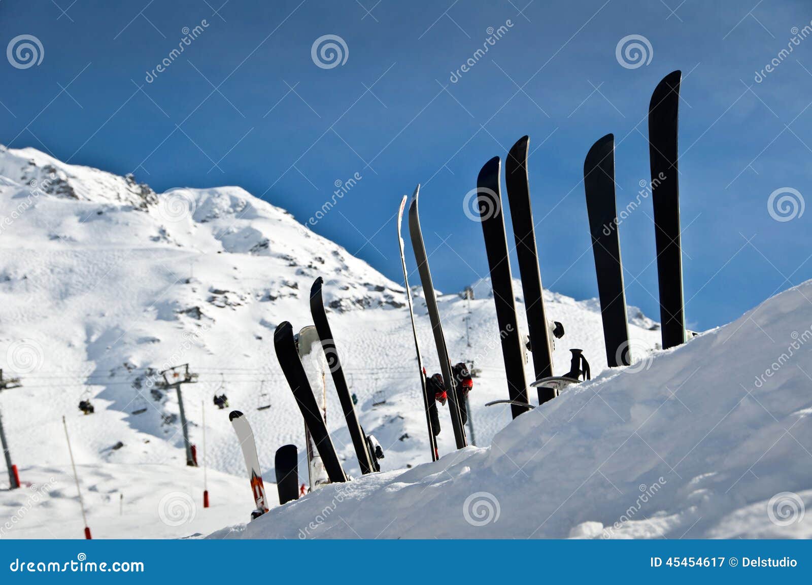 Line of skis in the snow stock image. Image of mountainside - 45454617