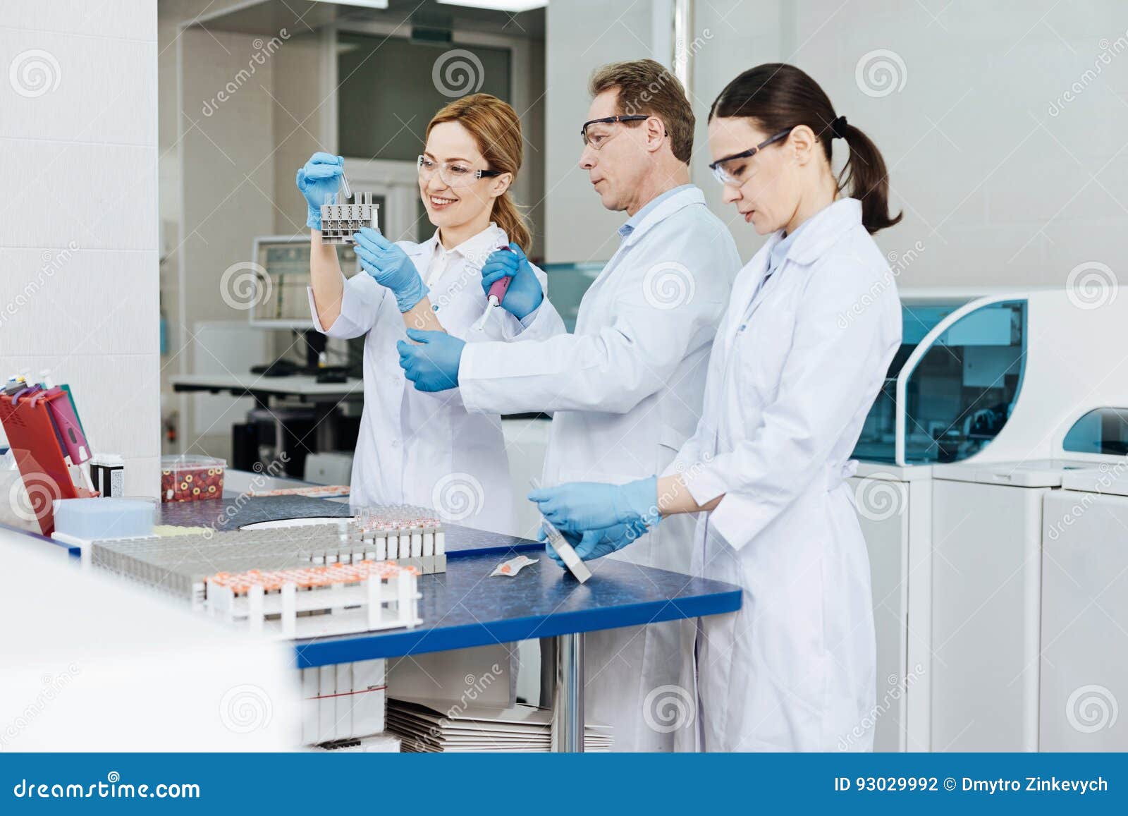 Line of Three Colleagues Working at Modern Lab Stock Photo - Image of ...